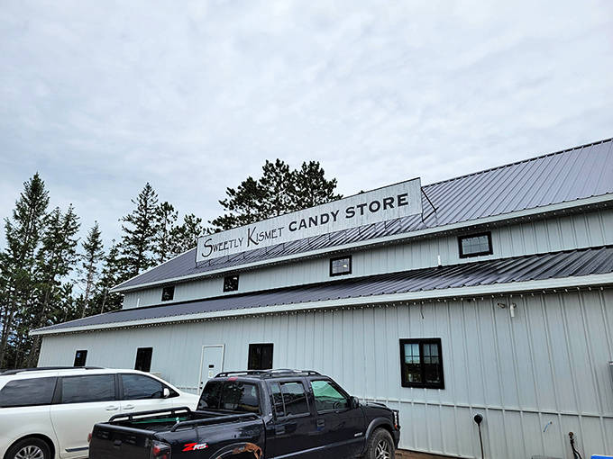 The simple white exterior of Sweetly Kismet hides a treasure trove of treats inside, standing tall against Minnesota's northern sky.
