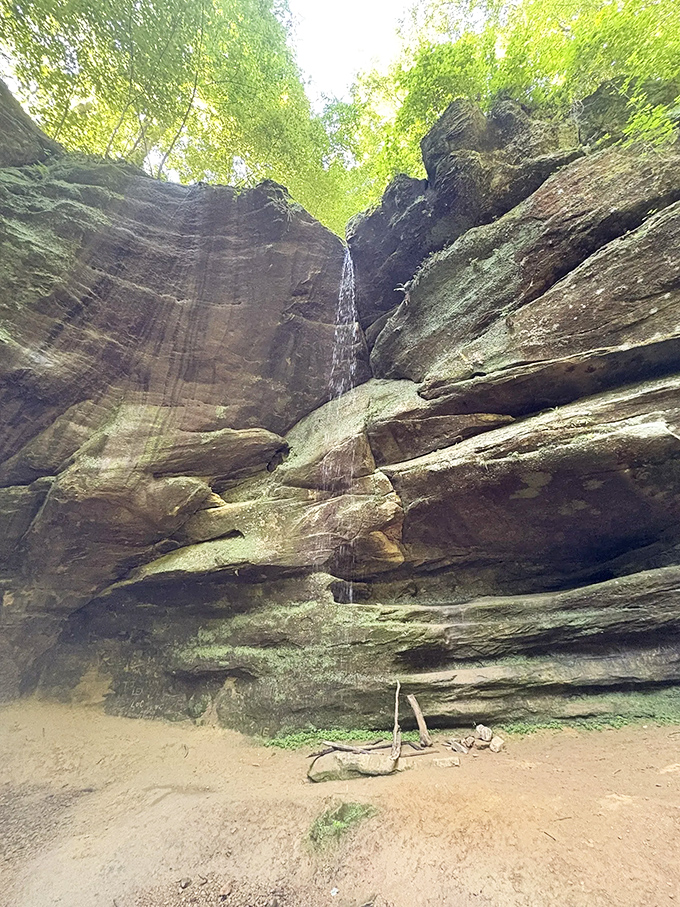 The waterfall's elegant descent creates a natural spotlight against the rugged rock face &ndash; Mother Nature's version of dramatic stage lighting.