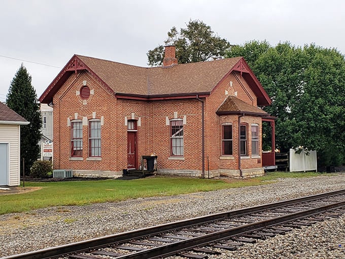 This red brick beauty near the railroad tracks has witnessed more history than most museums, and it's still standing strong.