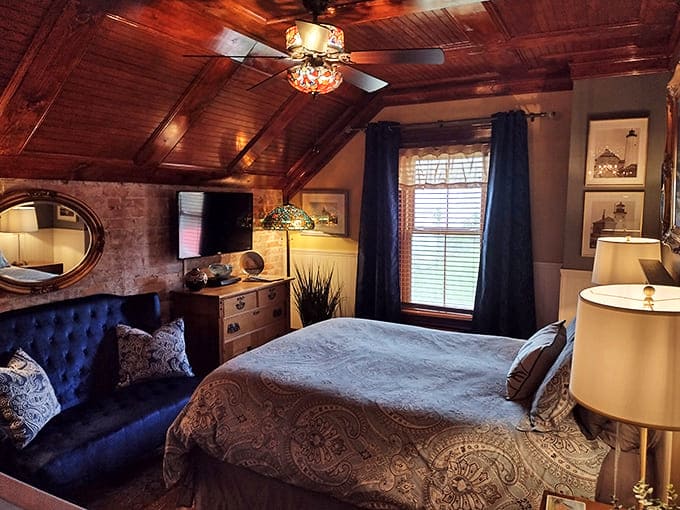 Sweet dreams come standard in this charming bedroom, where rich wood ceilings and blue accents create a nautical haven of comfort.