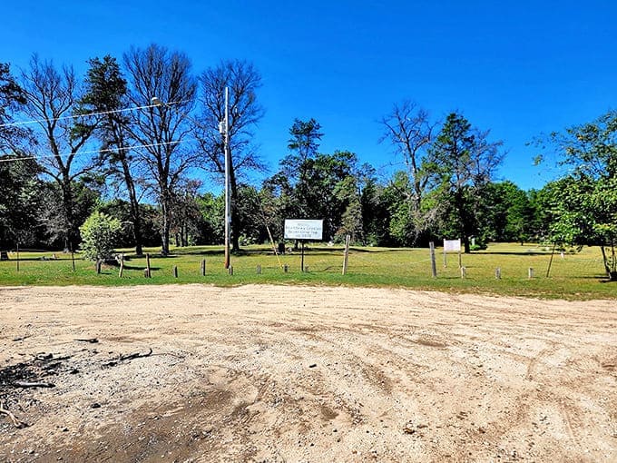 Sandy soil and scattered markers tell the tale of a community that vanished almost overnight, leaving only this solemn ground behind.