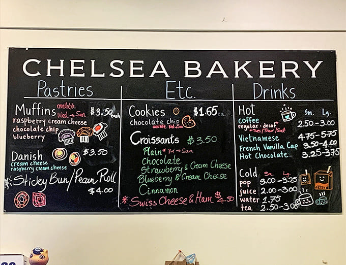 The handwritten chalkboard menu showcases daily offerings from muffins to croissants, each description more mouth-watering than the last.