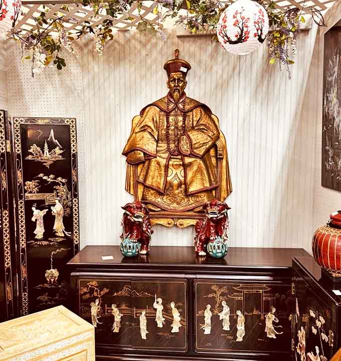 This golden emperor figure commands attention amid Asian antiquities, silently judging your decision not to buy him. He's seen dynasties rise and fall – your hesitation means nothing.