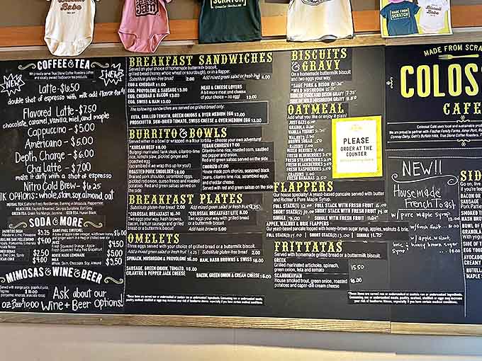 The chalkboard menu at Colossal Cafe reads like a breakfast lover's dream journal, with options that might cause delicious decision paralysis.