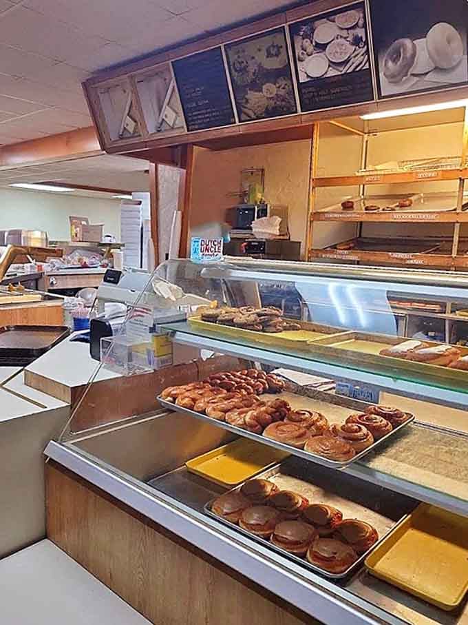 Behind this counter, magic happens daily. The display case is like a museum of edible art where everything is begging to be touched.