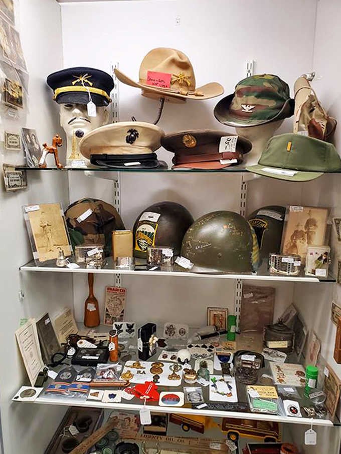 Military history comes alive through this carefully curated collection of service caps and helmets spanning multiple American conflicts.