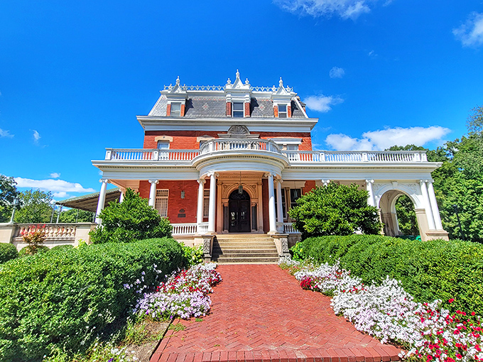 Ellwood House Museum rises majestically from its manicured gardens, the red brick Victorian mansion telling tales of barbed wire fortunes and Gilded Age opulence.
