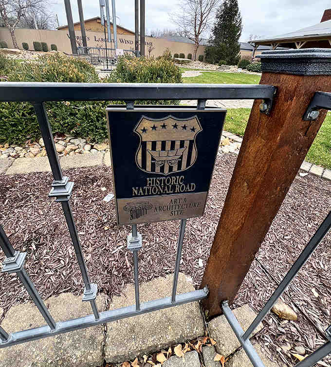 History meets whimsy where the Historic National Road marker stands sentinel near Casey's famous oversized attraction.