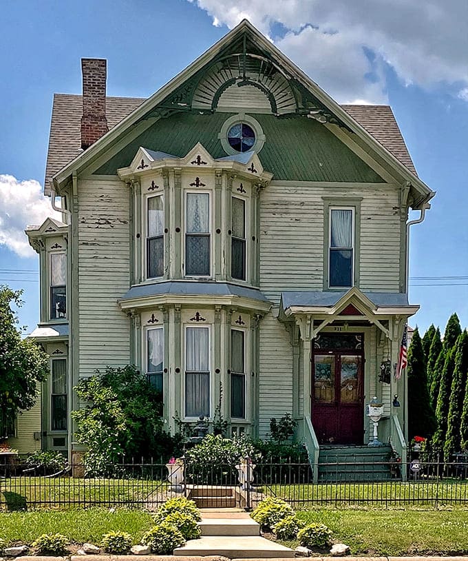 This Victorian beauty stands like a grande dame at a garden party, all gingerbread trim and dignified charm.