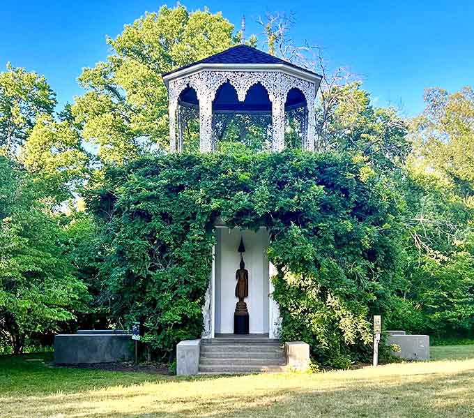 The House of Golden Buddhas peeks through lush greenery, a surprising Eastern treasure hidden in the Midwest like a fortune cookie in cornbread.