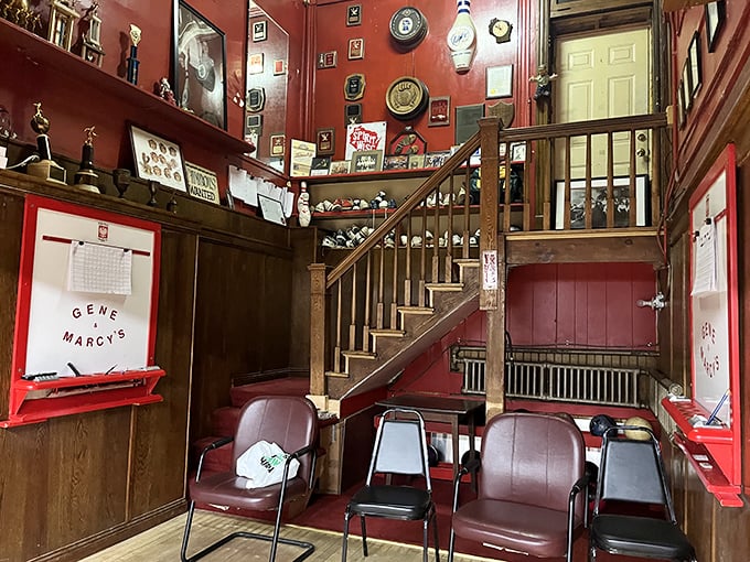 The cozy waiting area showcases decades of bowling memorabilia, trophies, and the unmistakable red walls that have witnessed countless celebrations.