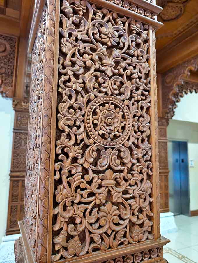 Not your average woodwork! This hand-carved column showcases the mind-boggling detail found throughout the temple, where every inch tells a story.