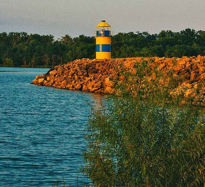 This cheerful yellow and blue lighthouse isn't just practical – it's become an iconic landmark for boaters navigating Carlyle's vast waters.