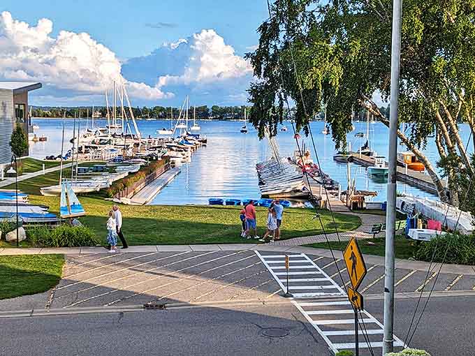 The Little Traverse Yacht Club marina showcases a forest of masts against blue waters, where sailing dreams bob gently at their moorings.