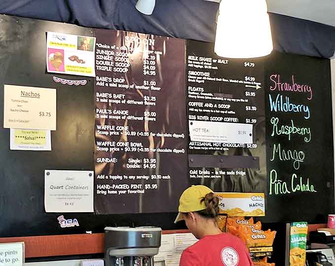 The menu board showcases a dazzling array of frozen delights and popcorn treasures, turning decision-making into a delicious dilemma.