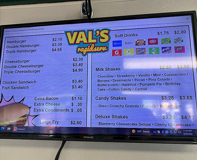 The digital menu board showcases Val's straightforward offerings, from classic burgers to an impressive array of shake flavors.