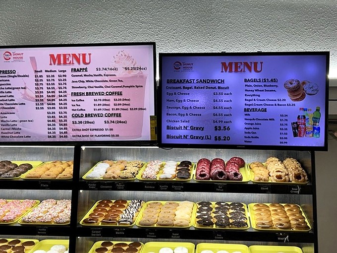 The menu board tempts with possibilities, from classic glazed perfection to breakfast sandwiches that might just change your morning routine forever.