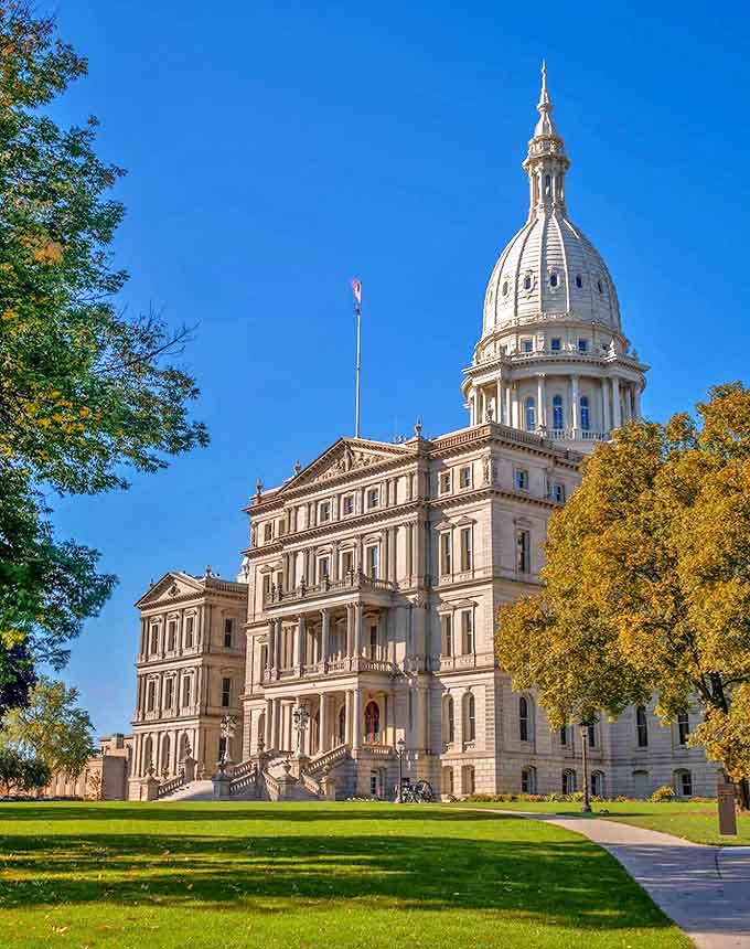 The Michigan State Capitol stands proud with its Renaissance-inspired dome, a limestone testament to democracy that's as beautiful inside as out.