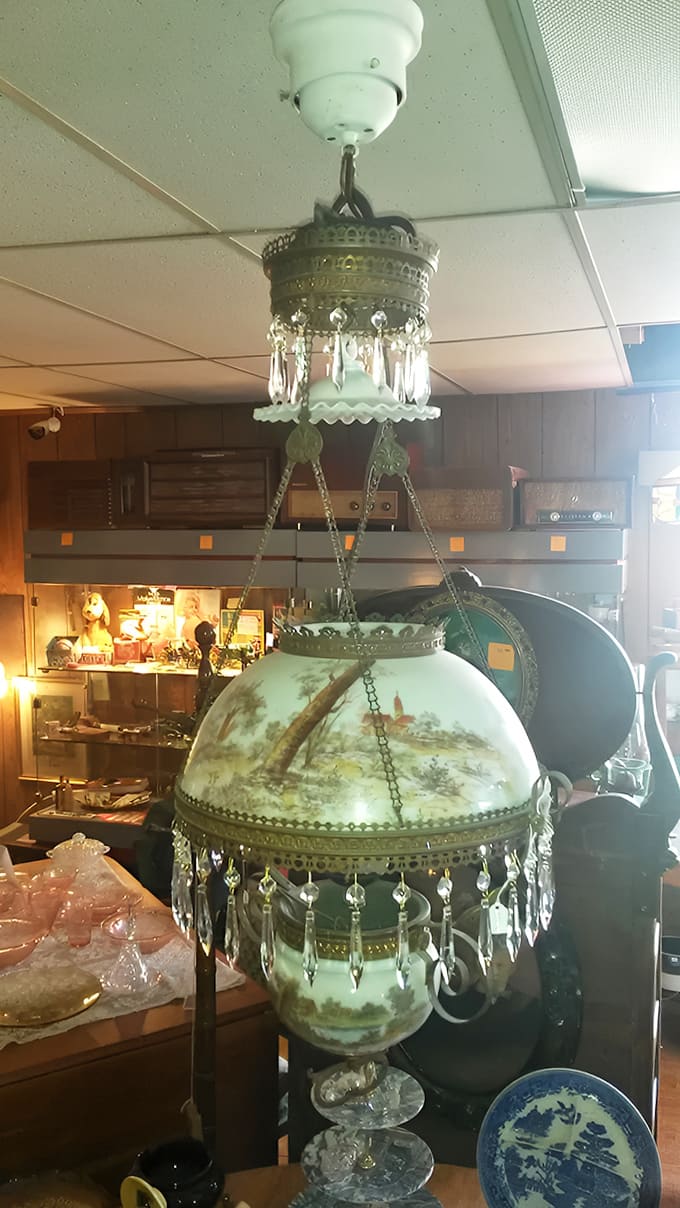 This isn't just a lamp – it's a cascading masterpiece of brass, crystal, and hand-painted glass that could transform any room into a conversation starter.