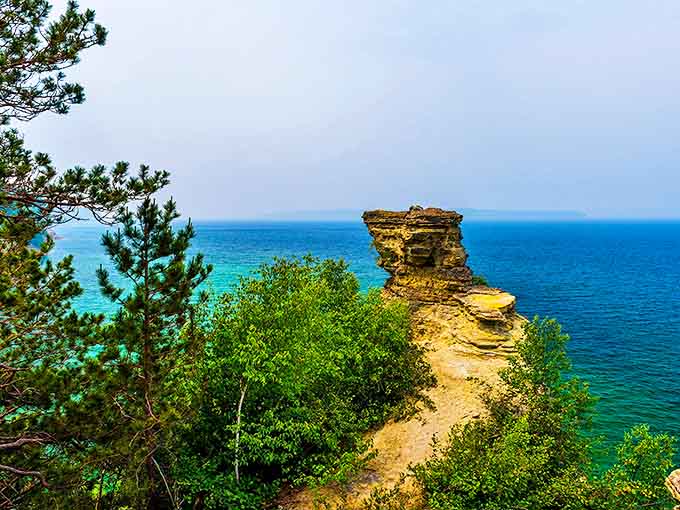 Standing sentinel over Lake Superior, this ancient rock formation has witnessed centuries pass while barely changing its stoic expression.