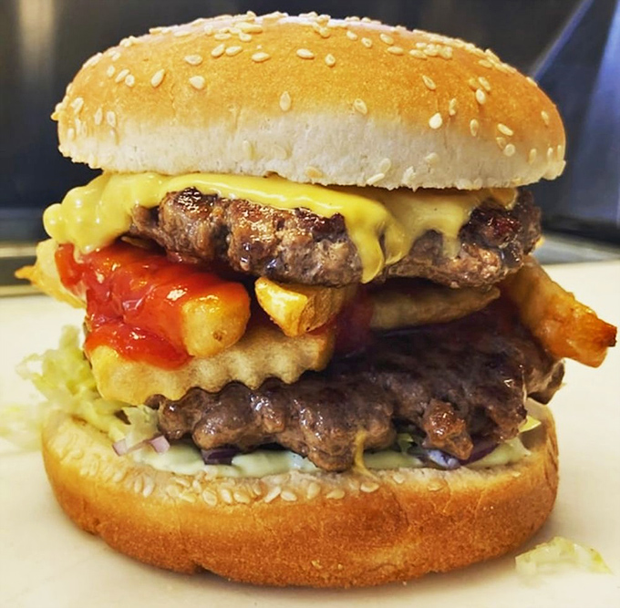 No Bull Burger: This towering masterpiece isn't just a burger &ndash; it's an architectural achievement with two beef patties, cheese, and fries stacked between sesame-speckled buns.