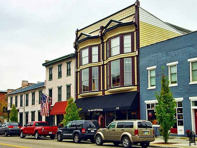 The Burwell Building stands proudly on Main Street, its yellow facade a cheerful landmark in the historic district.