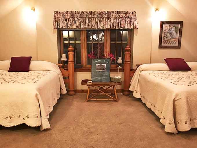 Cozy twin beds and warm lighting transform what was once a utilitarian space into a surprisingly comfortable retreat for modern travelers.