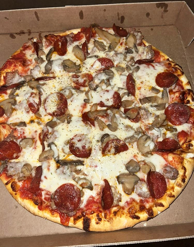 Mushroom and pepperoni perfection &ndash; each slice a testament to the beauty of simplicity done right.
