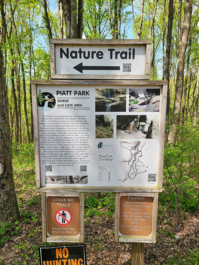 The informative trail sign reveals Piatt Park's secrets – a gorge and cave system waiting to be explored.