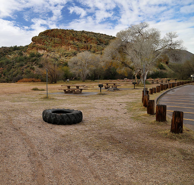 The picnic area offers a perfect respite from swimming, with rustic tables nestled among desert vegetation and mountain views.