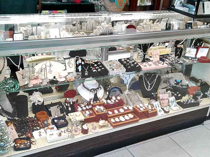 Vintage jewelry sparkles under glass, each piece whispering tales of formal dances, anniversary celebrations, and fashion statements from bygone eras.