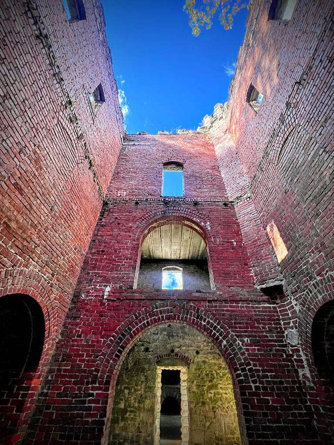 Soaring brick walls reach toward the sky, creating a cathedral-like space where history and imagination collide beautifully.