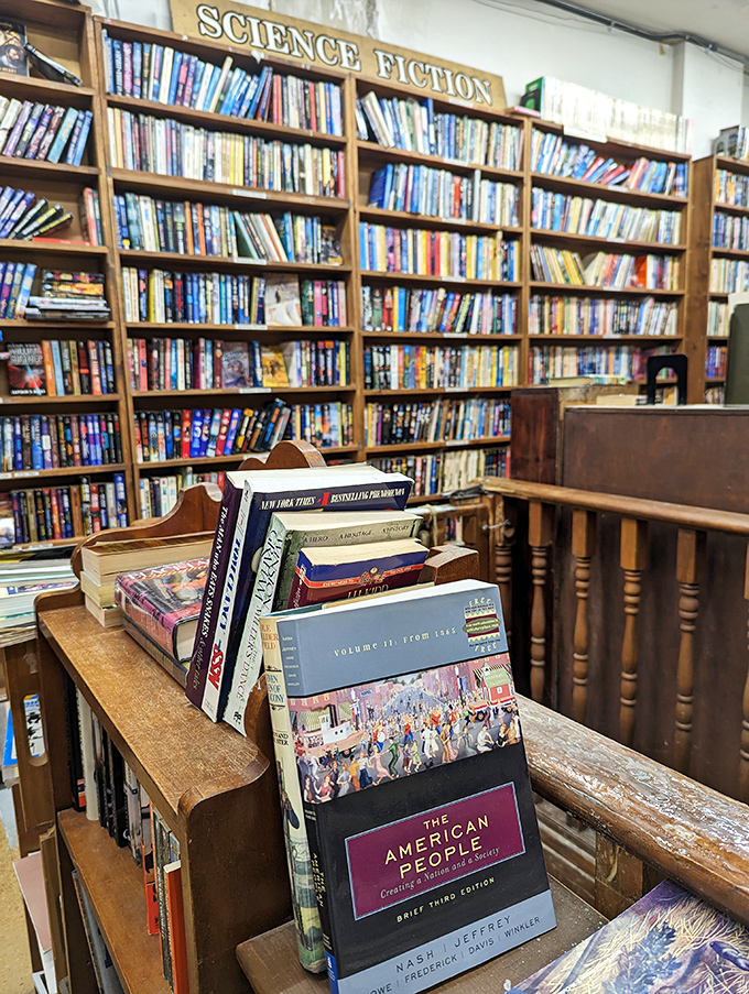 The science fiction section stands as a testament to human imagination, with colorful spines promising adventures beyond our earthly boundaries.