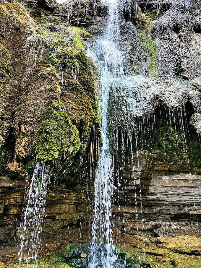 Up close, the falls reveal their intricate patterns &ndash; water threading through rock like nature's own lace curtains.