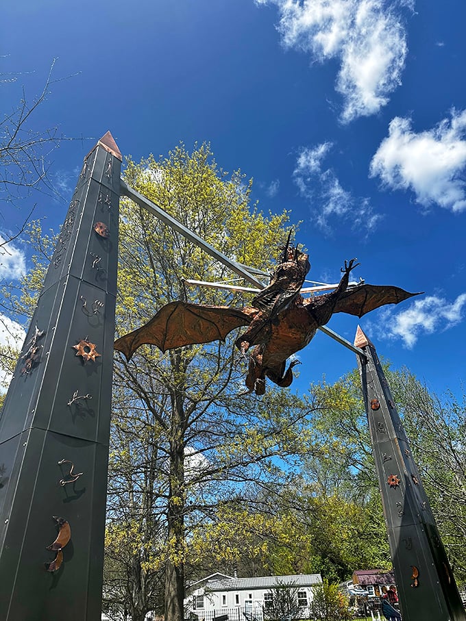 This magnificent dragon seems frozen mid-flight, its wings spread wide as if about to swoop down on unsuspecting visitors.
