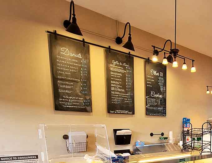 The handwritten menu boards showcase a tempting lineup of treats that reads like a bucket list for serious dessert enthusiasts.