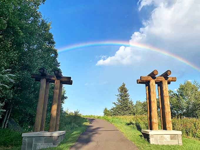 Not all gateways lead to Narnia, but this trailhead entrance with its rainbow arc comes pretty darn close.