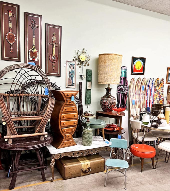 Mid-century modern meets Victorian elegance in this eclectic display. That wicker chair has probably heard stories you wouldn't believe.