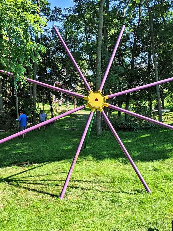 This purple spoke sculpture is basically a giant jacks game piece, if jacks were designed by someone with serious welding skills.