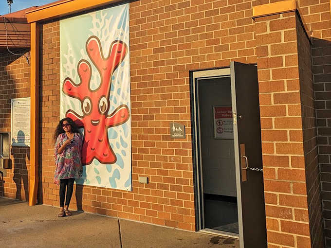 Vibrant coral-themed artwork welcomes visitors to the facilities, proving even necessary pit stops can have personality at this aquatic playground.