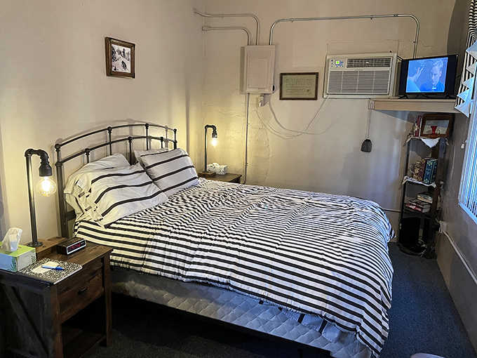 The jailer's quarters offer a more traditional sleeping arrangement with modern comforts, though the building's history is evident in every corner.