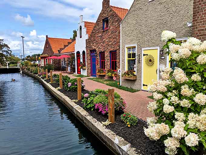 Colorful Dutch-inspired cottages line the canal, bringing a touch of Netherlands charm to Michigan with their distinctive architecture and vibrant gardens.