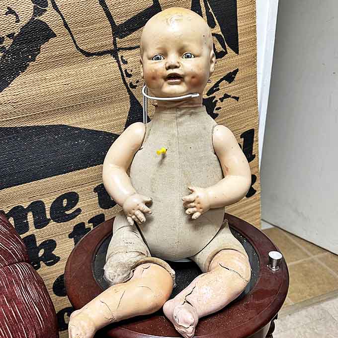 This vintage doll has seen things. Probably your soul. Definitely your nightmares. Still oddly charming though!