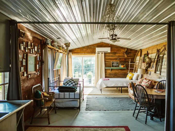 Sweet dreams guaranteed in this cozy bedroom where reclaimed wood walls embrace you like a warm Minnesota welcome.