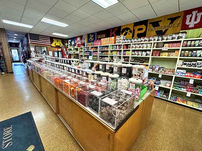 College pennants line the walls, creating a colorful corridor that celebrates school spirit while customers browse for their favorite sweets.