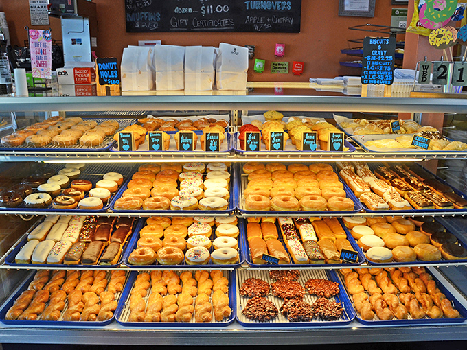Donut heaven exists, and it's arranged in neat rows behind this glass. Choose wisely, or just try one of each.