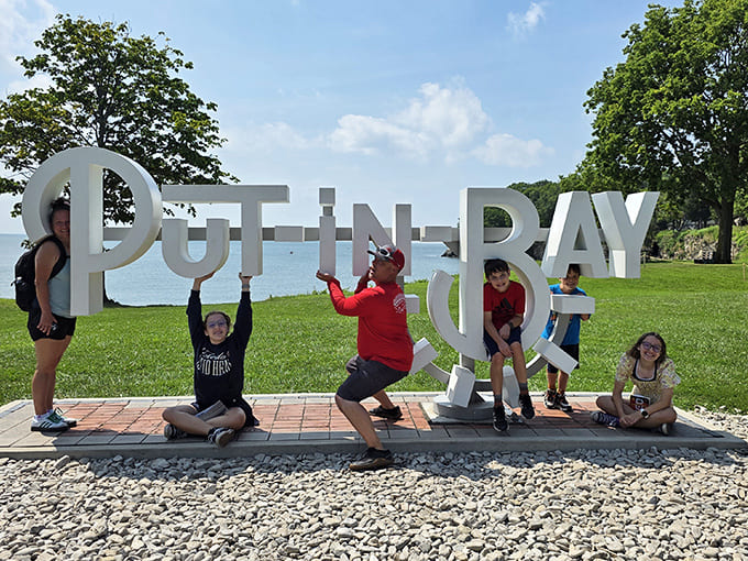 The iconic Put-in-Bay sign becomes an instant photo op, where visitors create memories against the backdrop of Lake Erie.
