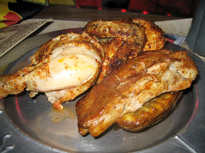 The star of the "Royal Feast" – a perfectly roasted half chicken meant to be devoured with your hands, medieval-style.