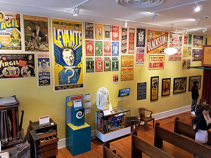 Vintage posters splash color across the museum walls, celebrating an era when magic meant more than swiping right.