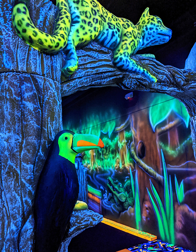 This isn't your average jungle cat! The fluorescent leopard lounges on its perch, its spots practically dancing under the black lights.